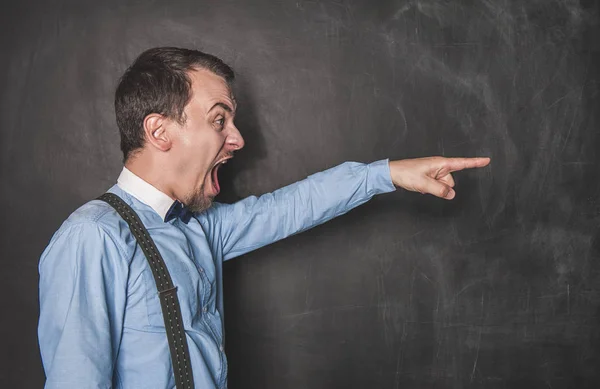 Angry screaming teacher man pointing out on blackboard Stock Photo by ...