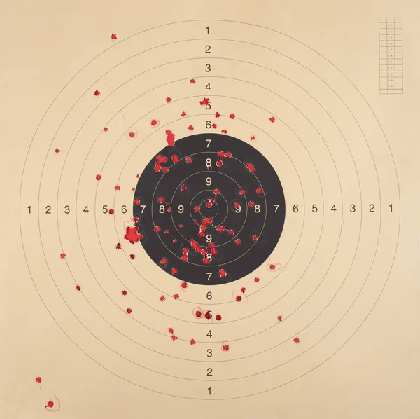 Old brown paper practice target for shooting with bullet holes in it ...