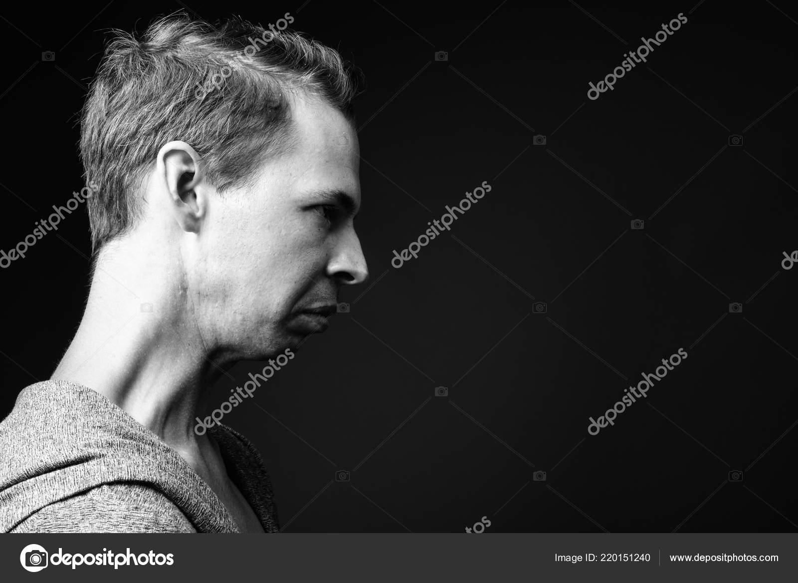 Rebellious man against black background in black and white Stock Photo ...