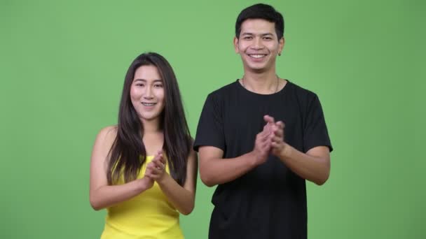 Young Asian couple clapping hands together — Stock Video ...
