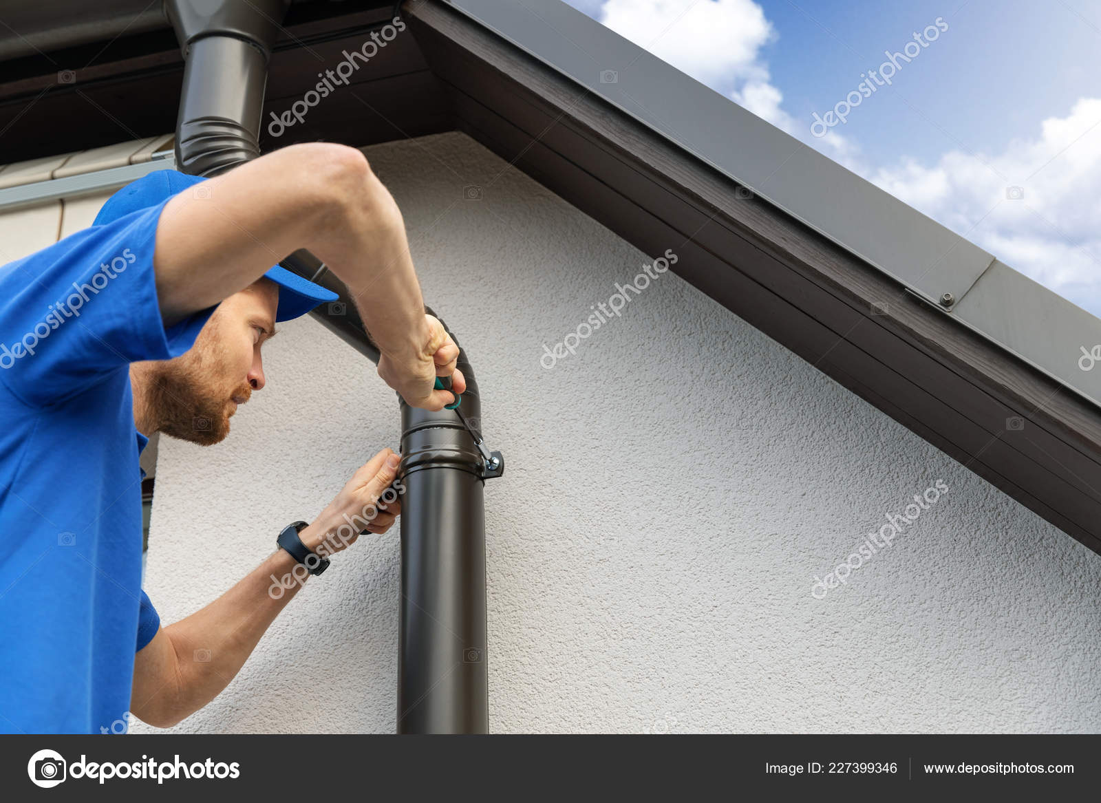 Worker Installing House Roof Gutter — Stock Photo © ronstik #227399346
