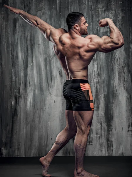 Muscular Bodybuilder Man Wearing Shorts Posing Studio Grunge Background ...