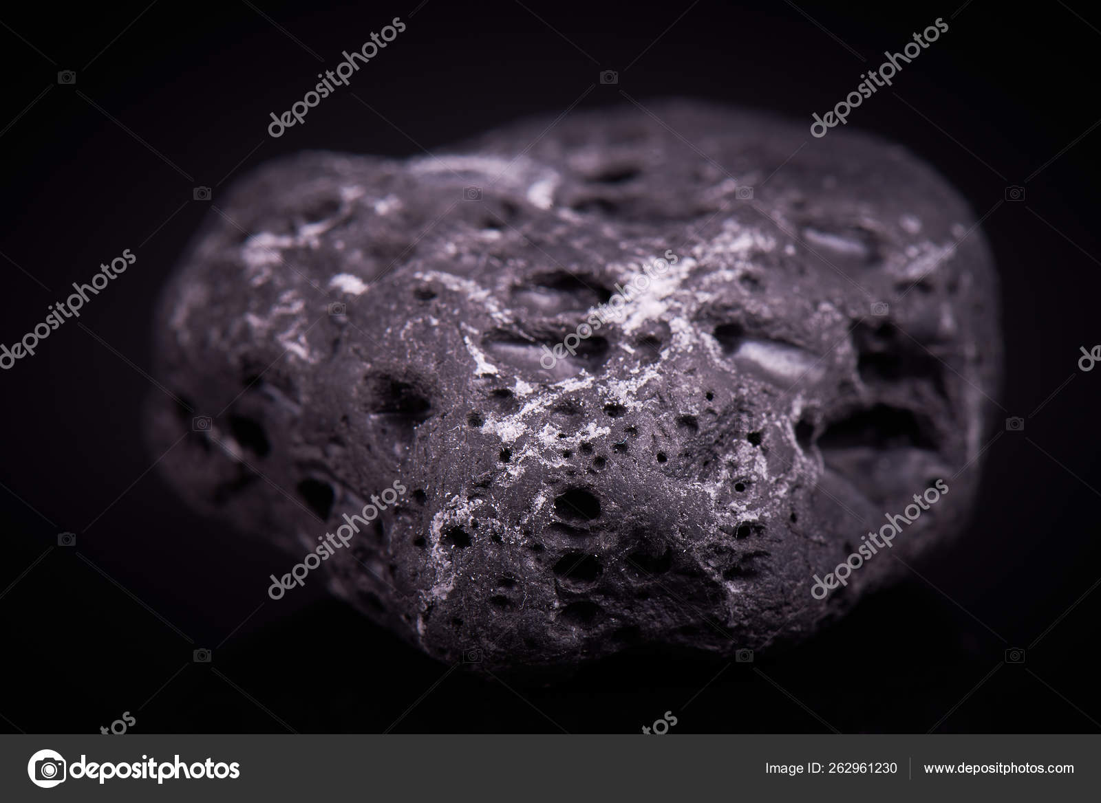 Black porous basalt stone Stock Photo by ©badahos 262961230