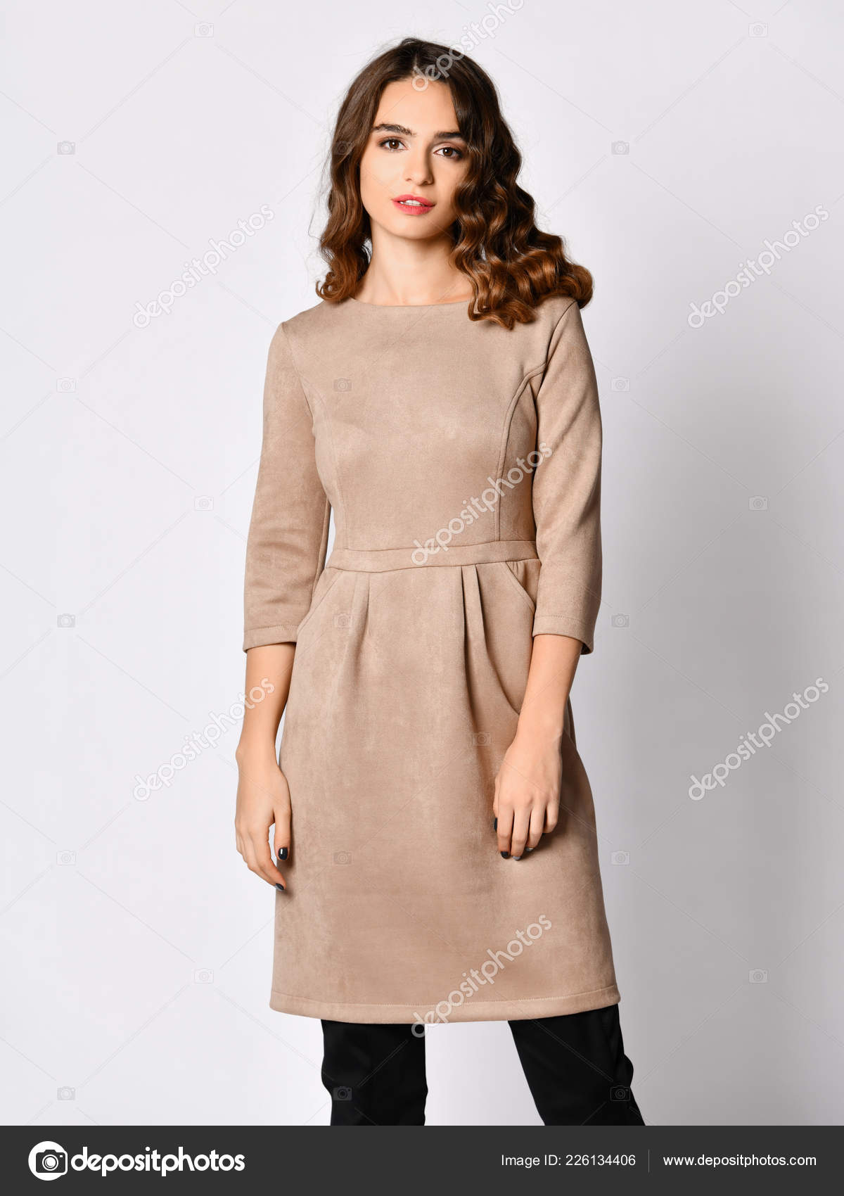 Young beautiful woman posing in new gray suede winter fashion dress ...