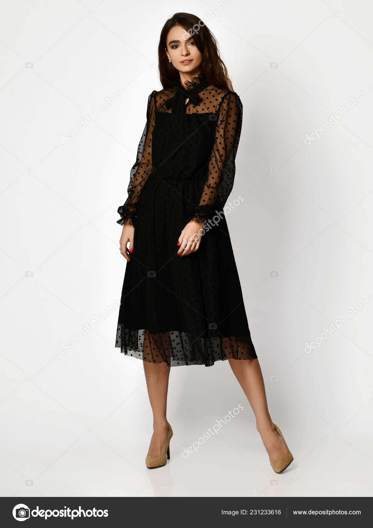 Young beautiful woman posing in new black fashion winter dress full ...
