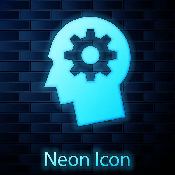 Glowing neon Human head with gear inside icon isolated on brick wall ...