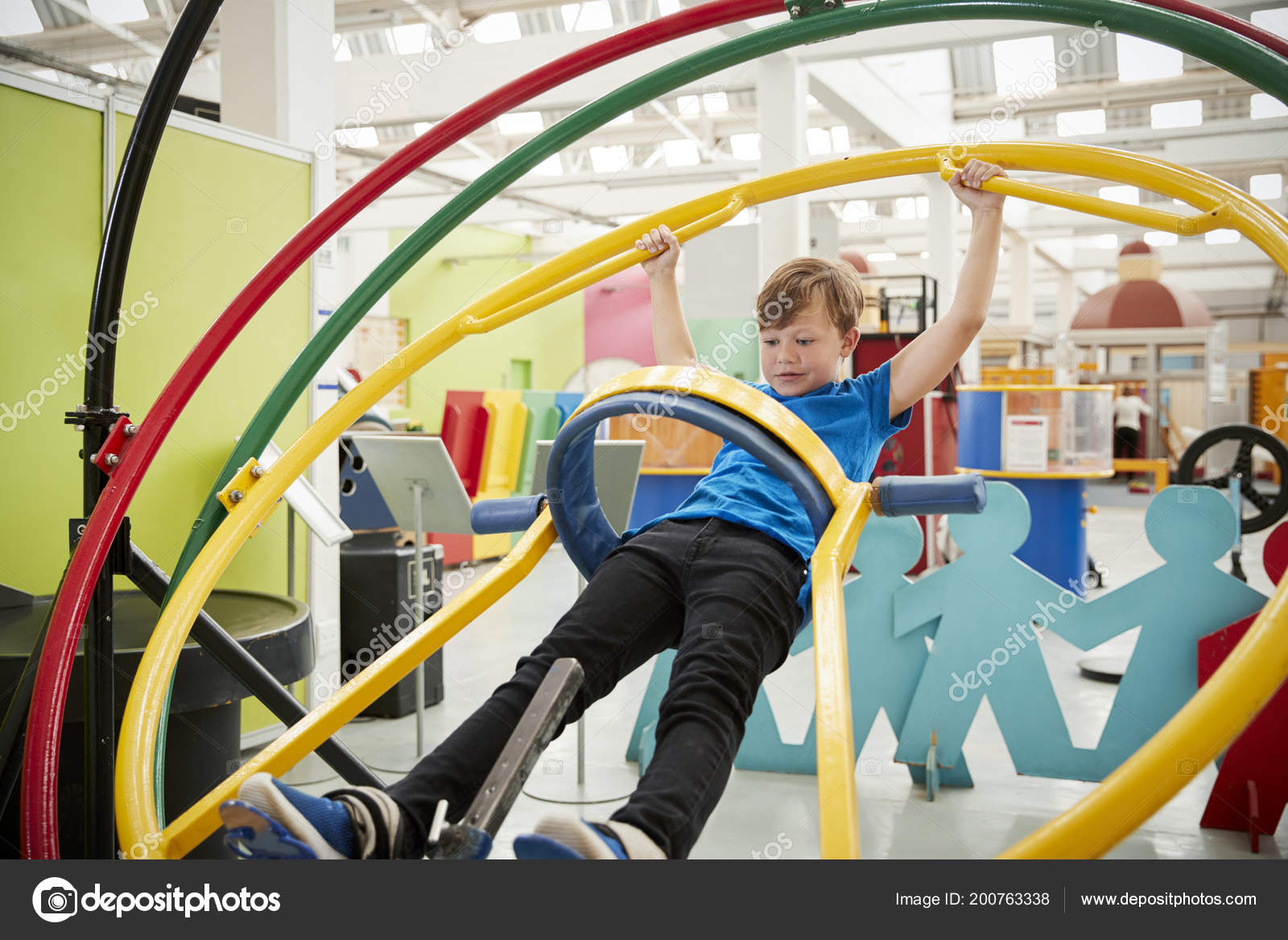 Young Boy Science Centre Using Human Gyroscope Stock Photo by ...