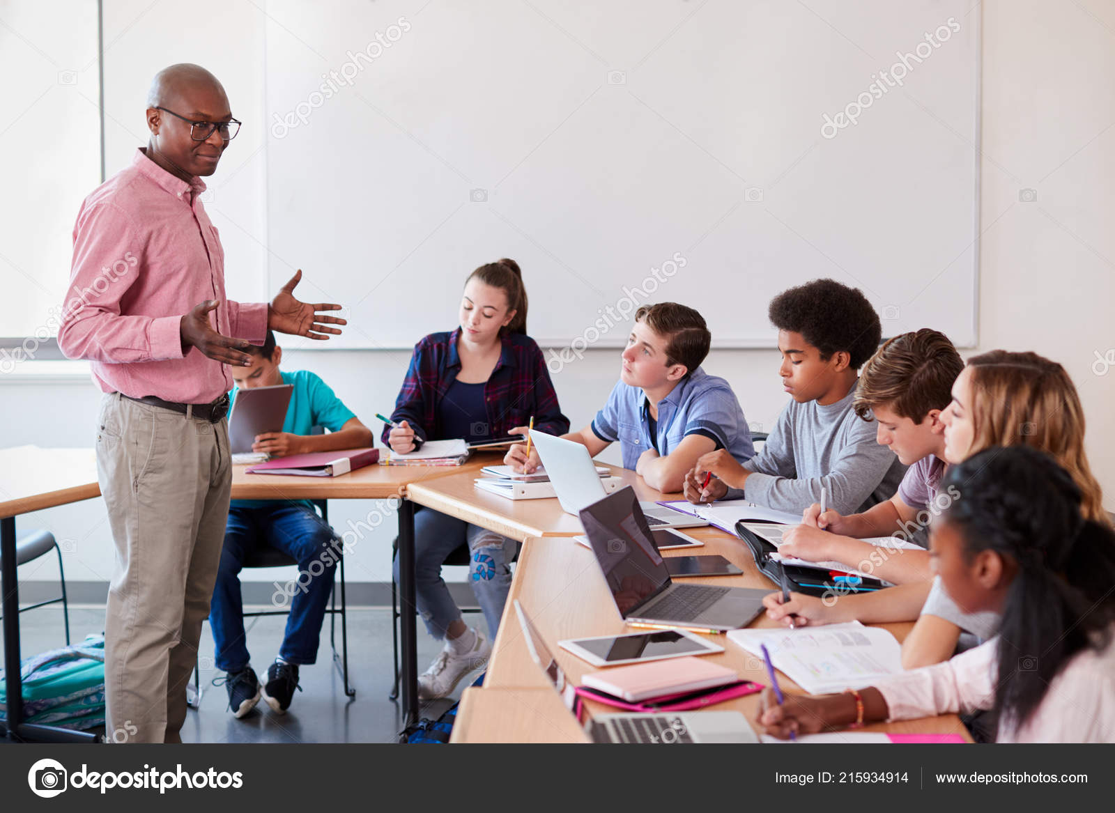 Teacher Talking To High School Student