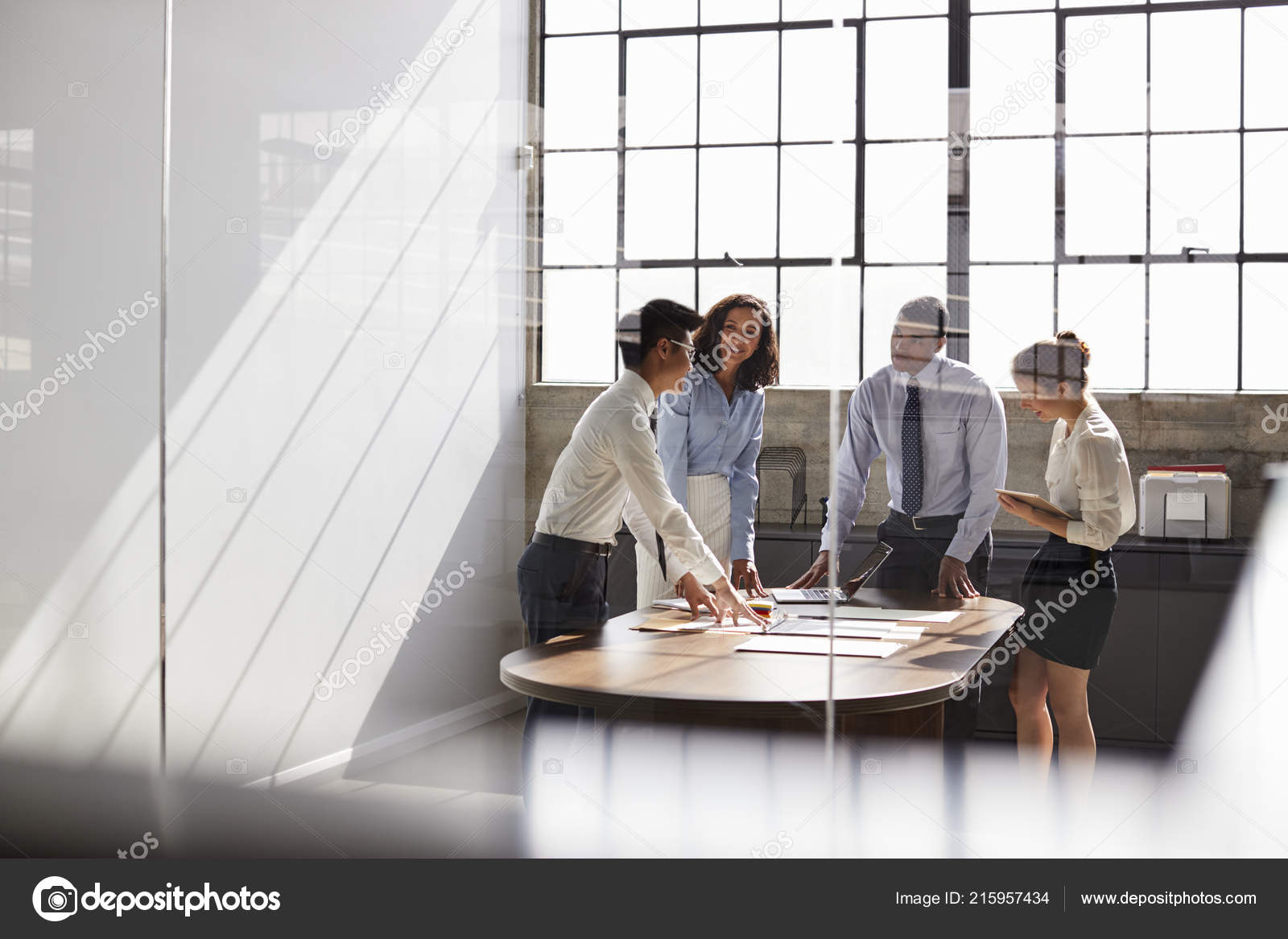 Business Team Seen Window Working Together Office Stock Photo by ...