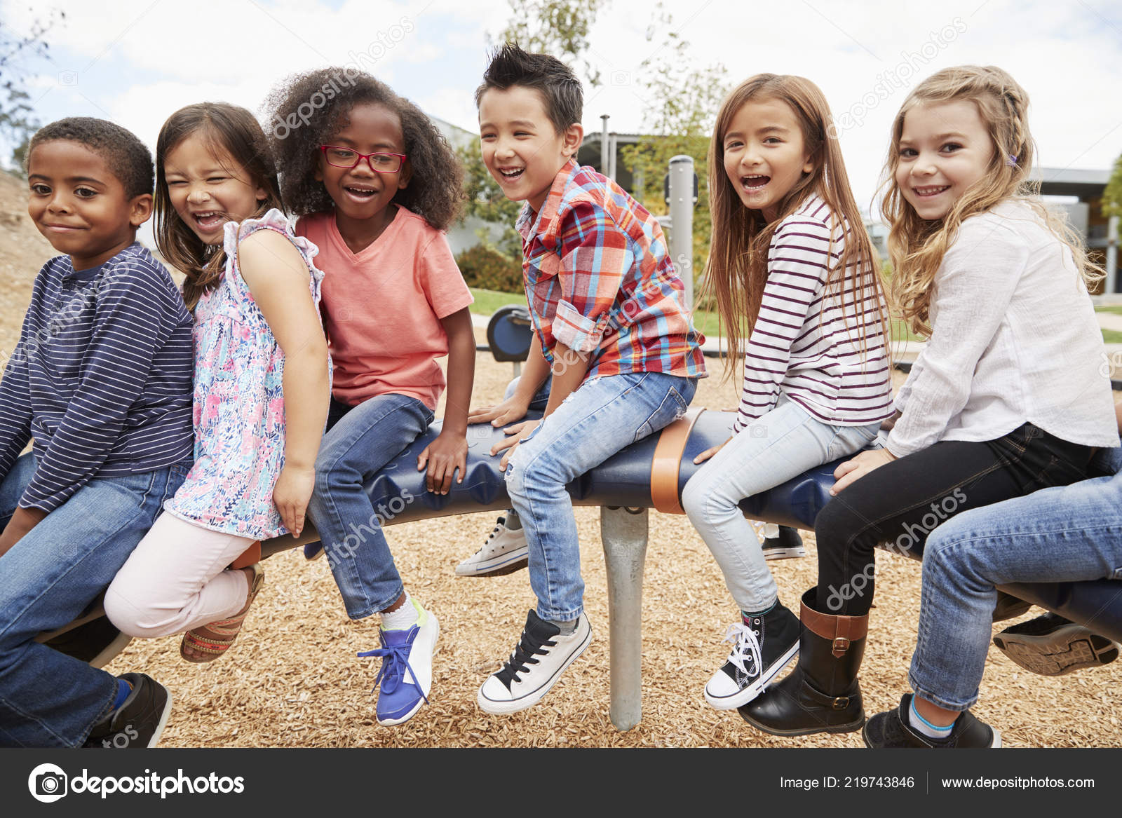 Kids Sitting Carousel Schoolyard Side View Stock Photo by ...