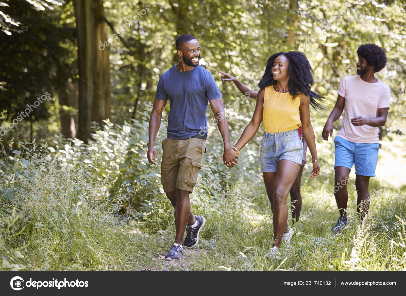 Black Couple Walking In Park