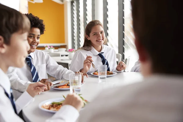 High school students eating in the school cafeteria Stock Photo by ...