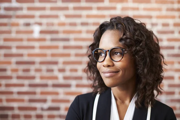 Portrait Smiling Businesswoman Wearing Glasses Standing Brick Wall