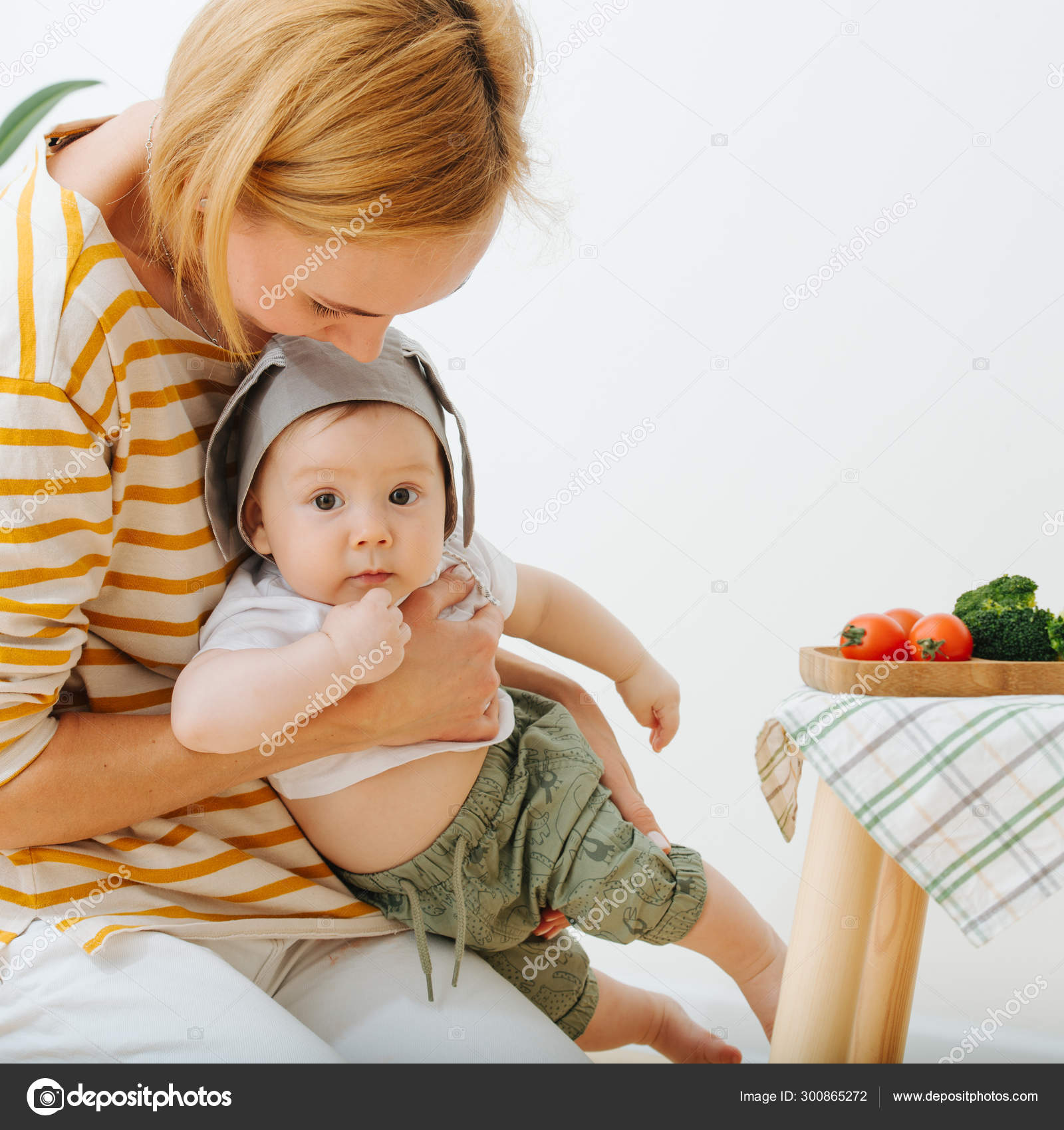 Active restless infant child is presented food Stock Photo by ©zzzdim ...