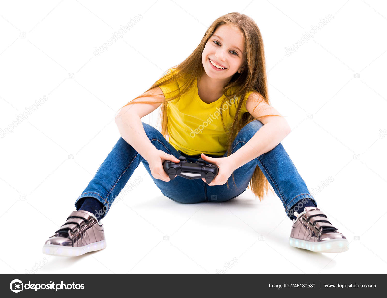 Girl playing computer games with a joypad Stock Photo by ©GekaSkr 246130580