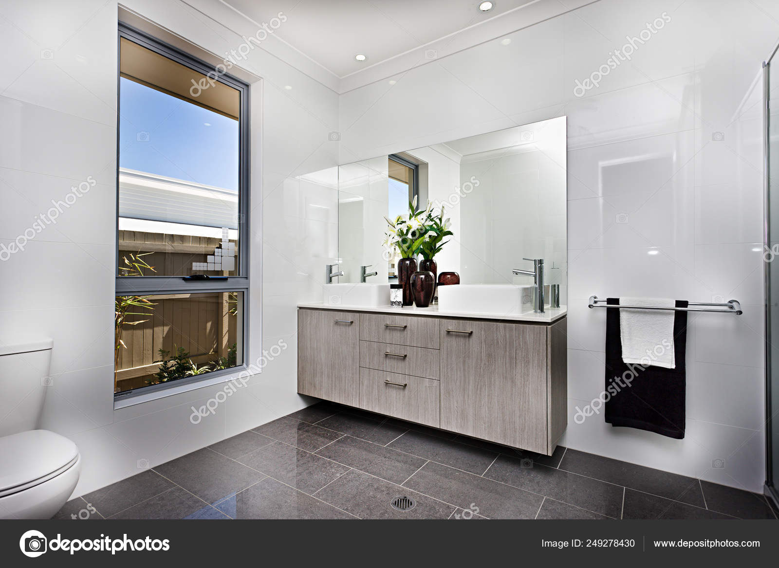 Luxury washroom with a window beside a bowl Stock Photo by ©jrstock1 ...