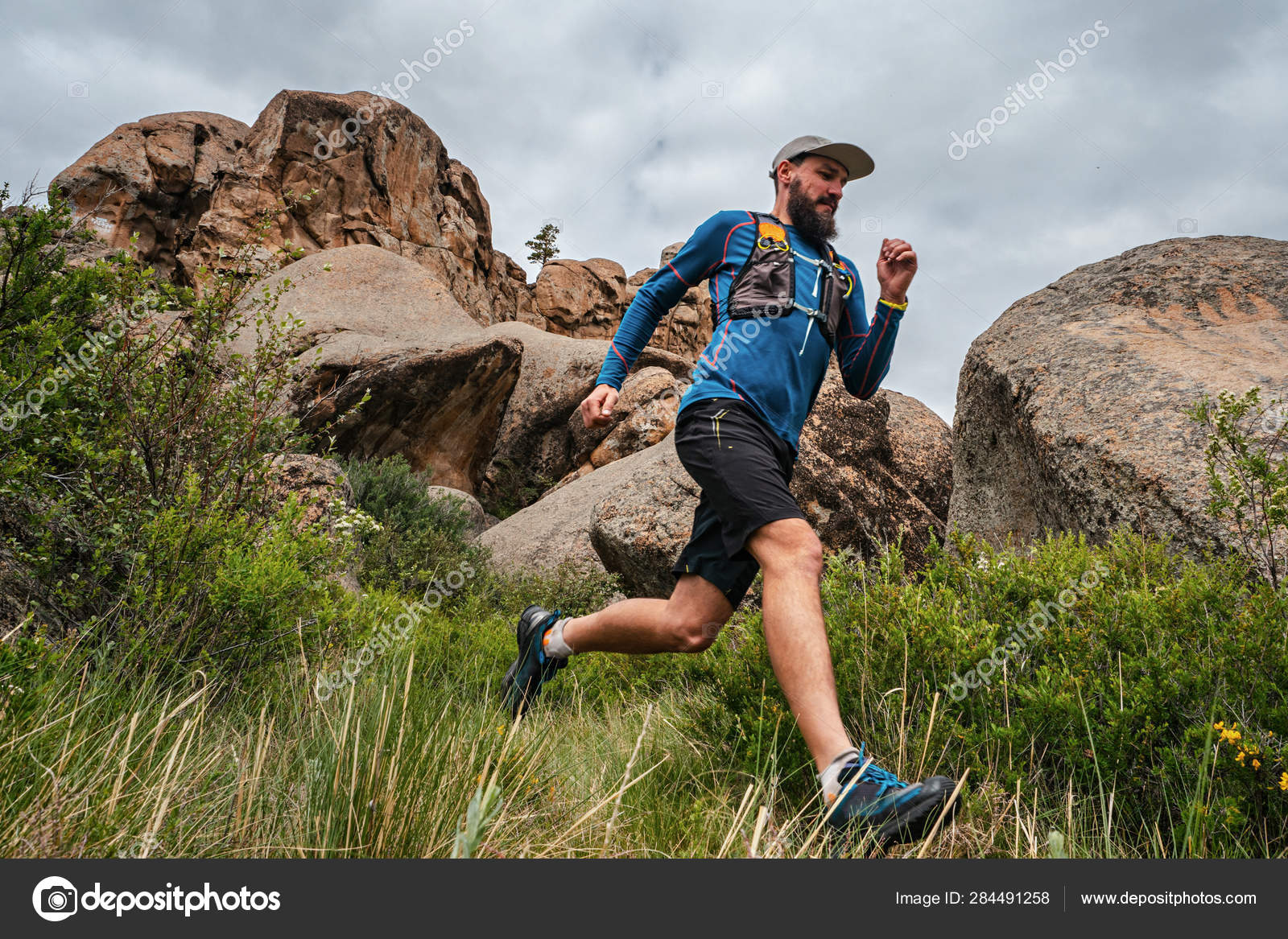 Male runner running on a mountain trail Stock Photo by ©vjSniper 284491258
