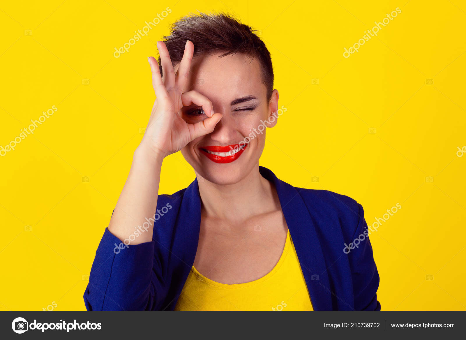 Woman Her Fingers One Eye Sign Hand Gesture Isolated Yellow Stock Photo ...