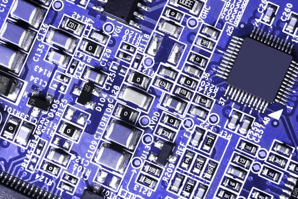 Macro shot of a Circuitboard with resistors microchips and electronic components. Computer ...