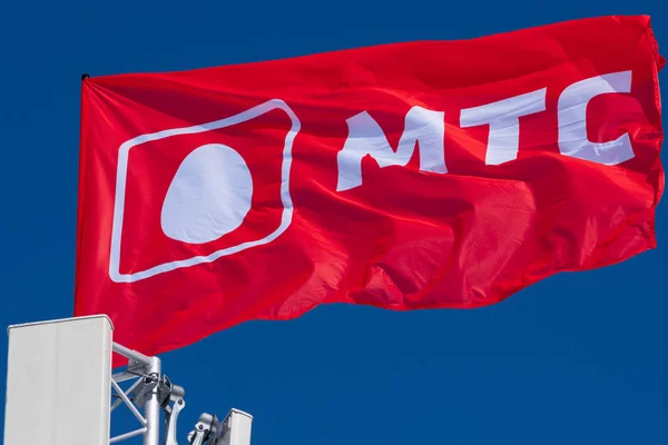 Flag with emblem, symbols of Mobile TeleSystems (MTS) - mobile operator ...