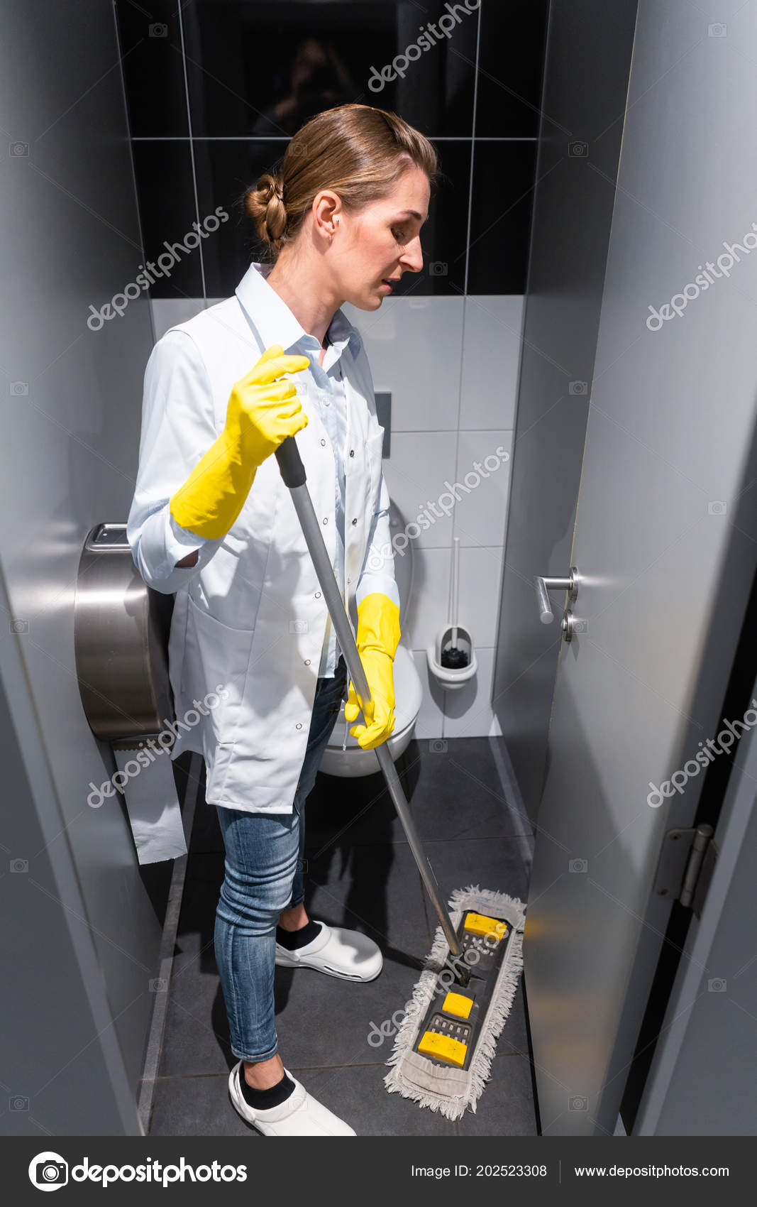 Janitor Cleaning Bathroom