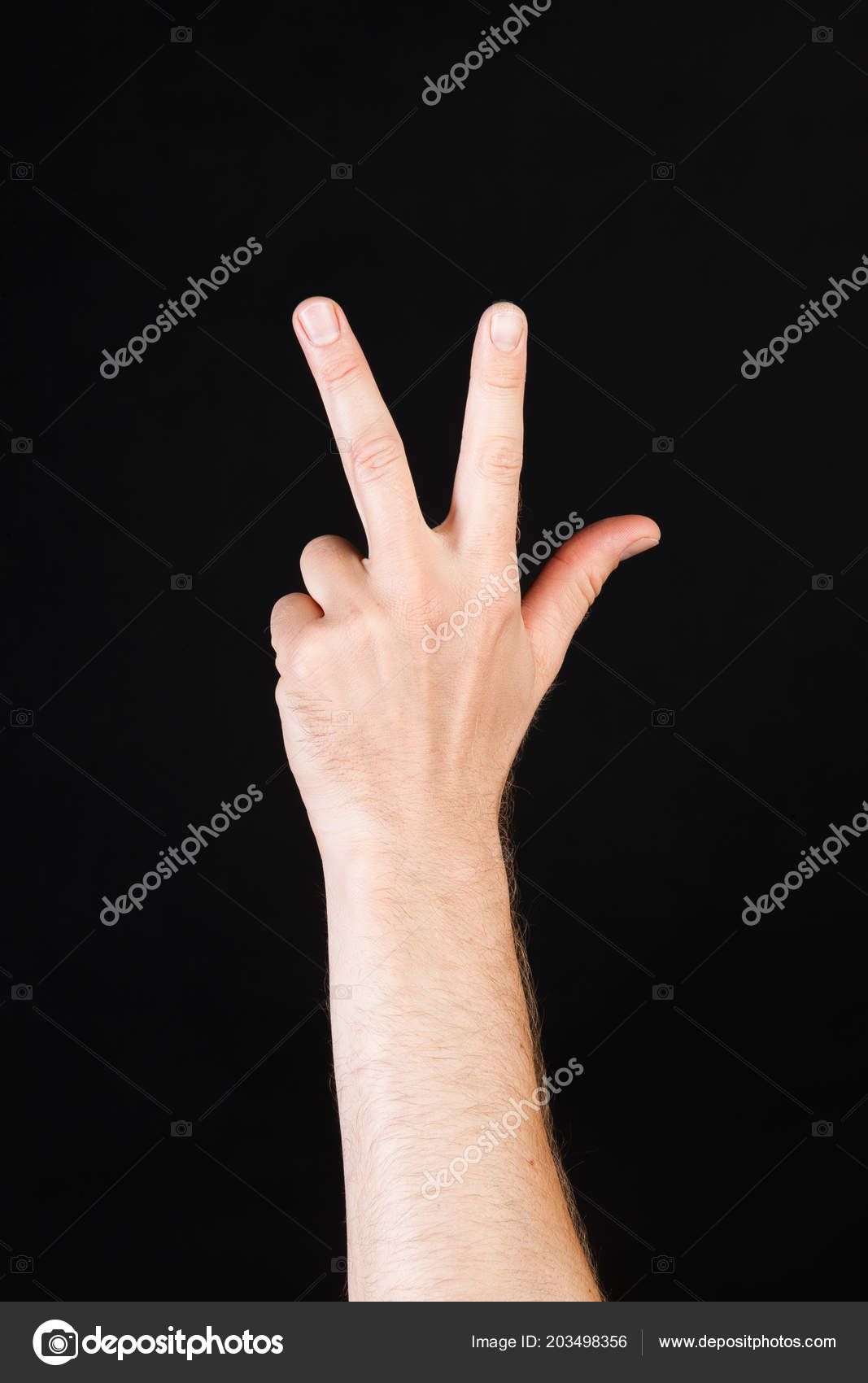Male Hand showing three fingers — Stock Photo © Kzenon #203498356