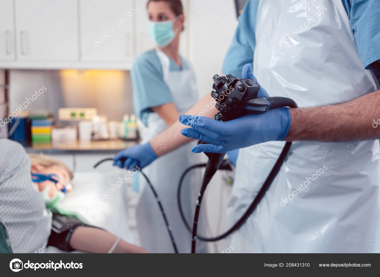Team of doctors performing endoscopy in hospital — Stock Photo © Kzenon ...