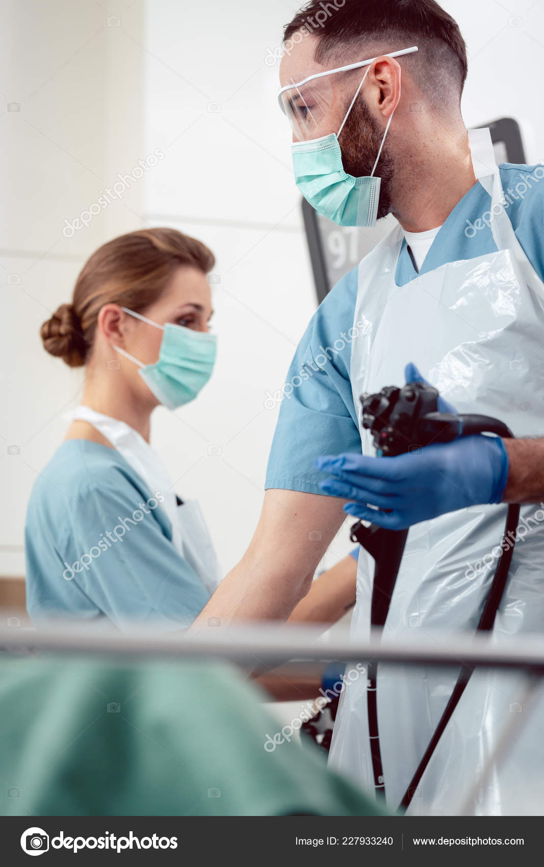 Team of doctors performing endoscopy in hospital — Stock Photo © Kzenon ...