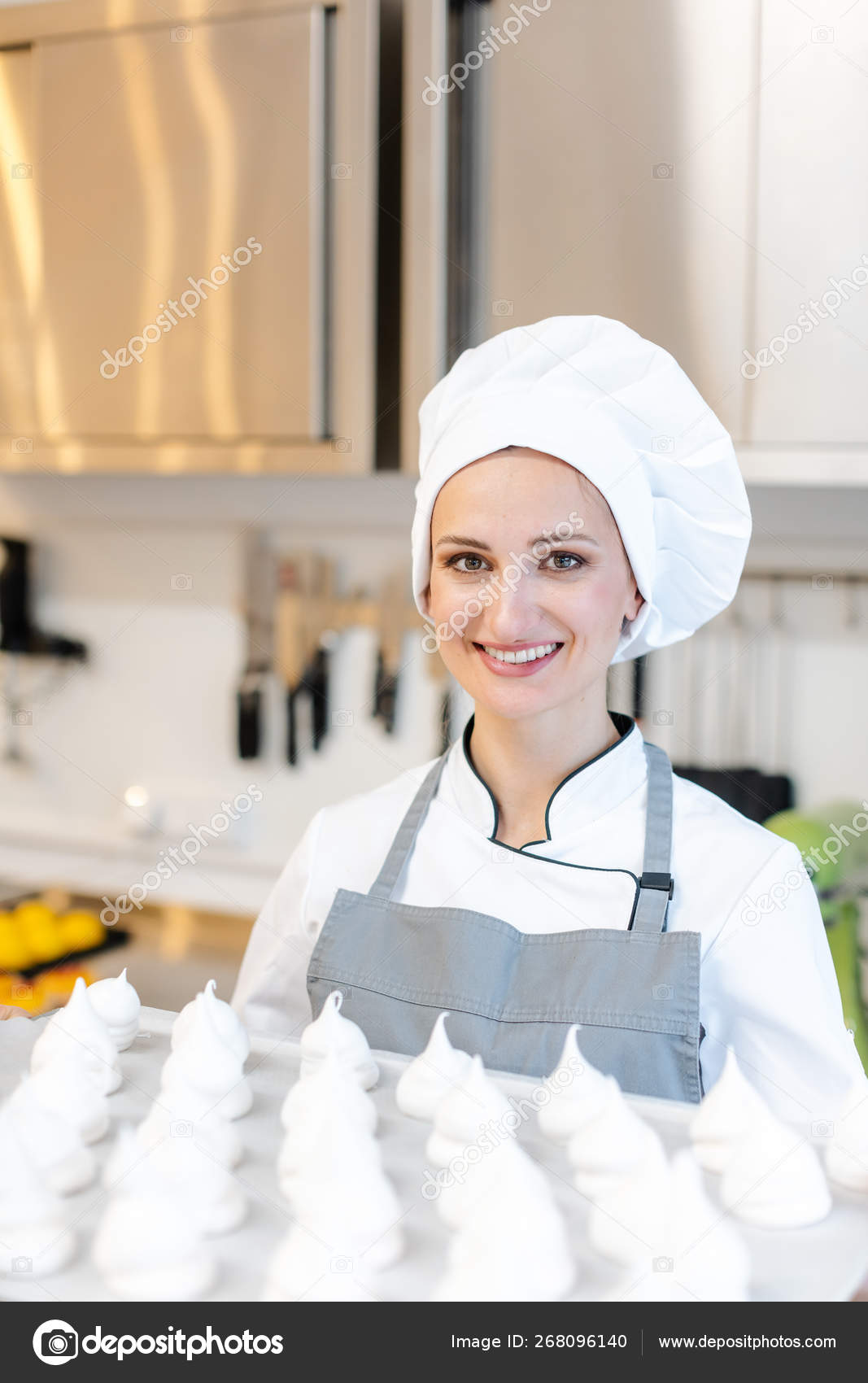 Patissier in her bakery shop with lots of meringue Stock Photo by ...