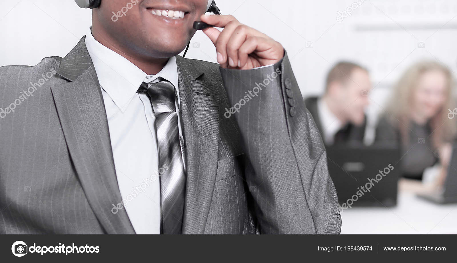 Foreground the employee call center with headset on the backgro Stock ...