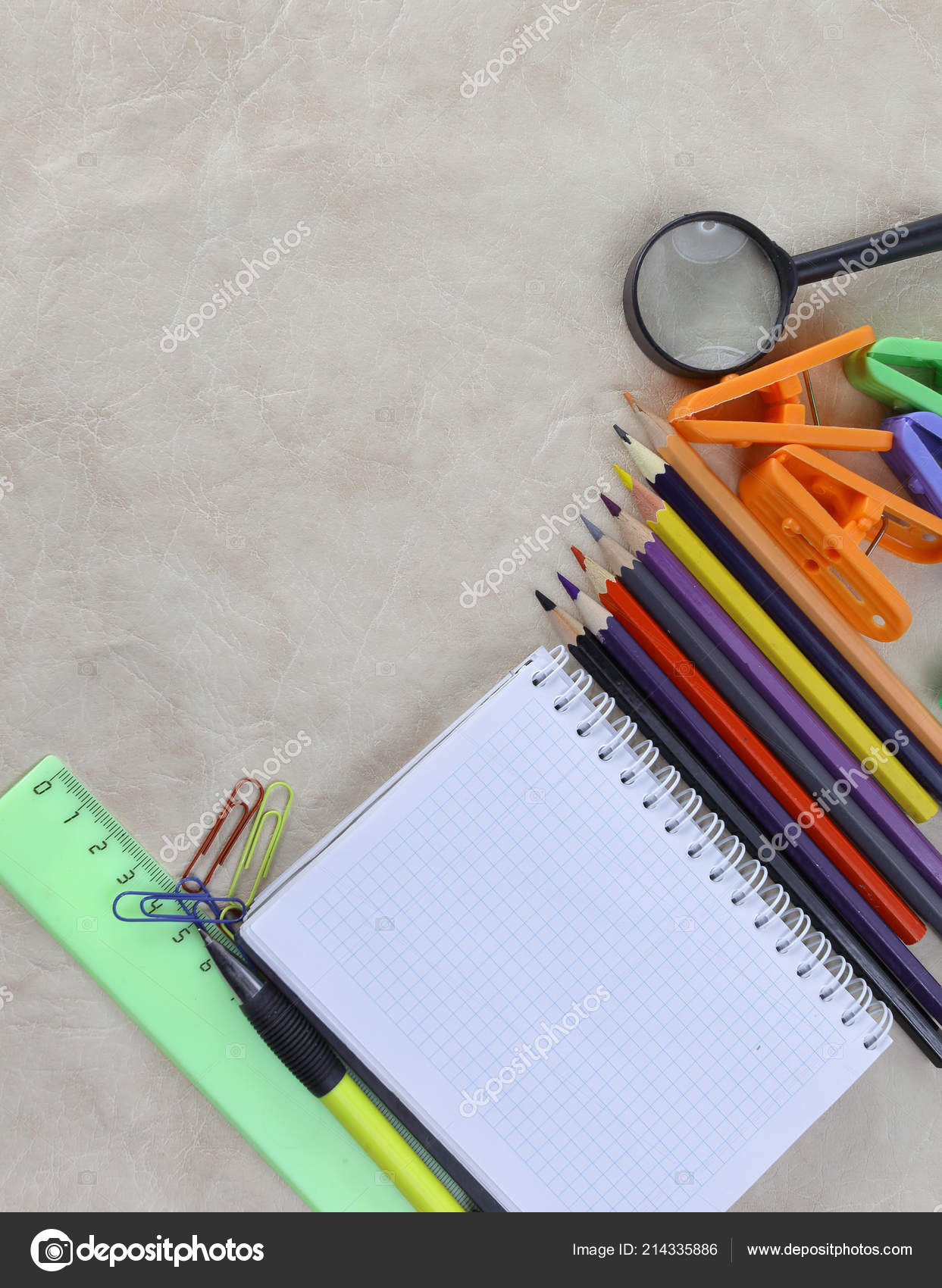 Notepad for taking notes and school supplies on a paper background ...