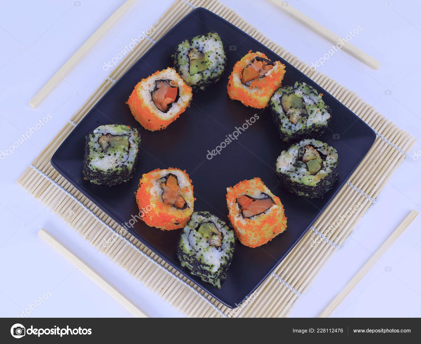 Different types of Maki sushi on a black plate — Stock Photo ...