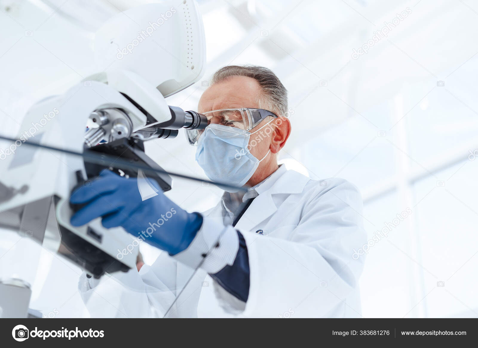 Close up. a serious scientist using a laboratory microscope. — Stock ...