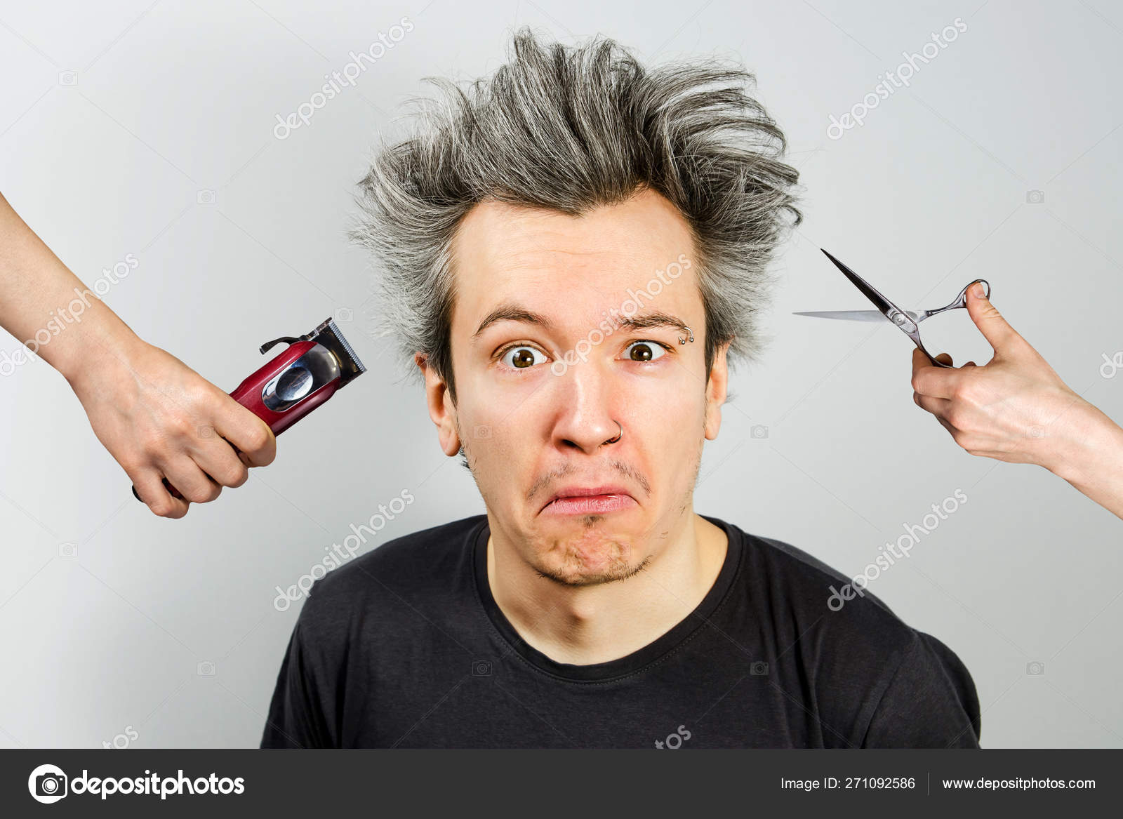 Hand with clipper and hand with scissors cut overgrown unshaven guy ...