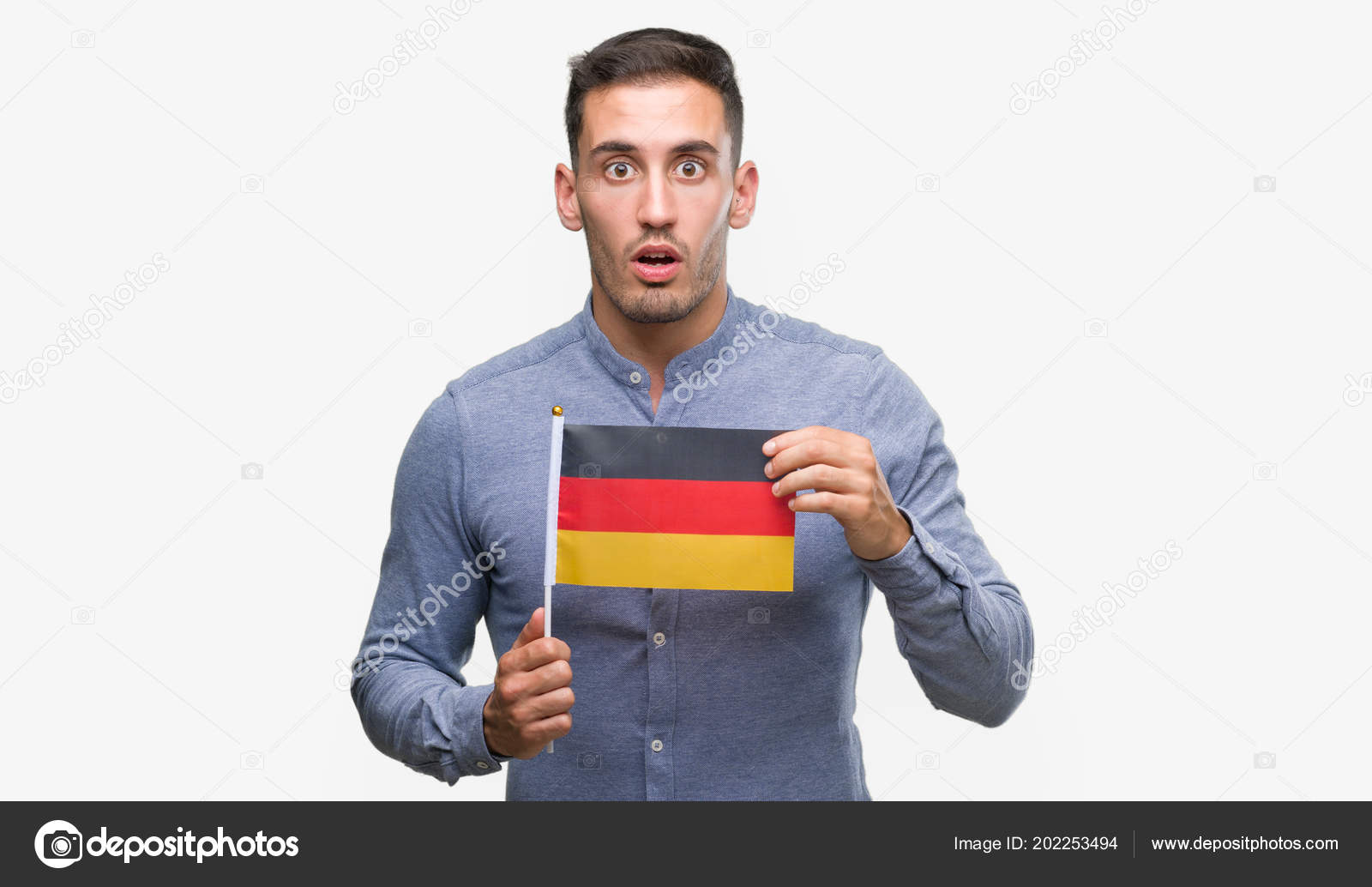 Handsome Young Man Holding Flag Germany Scared Shock Surprise Face ...