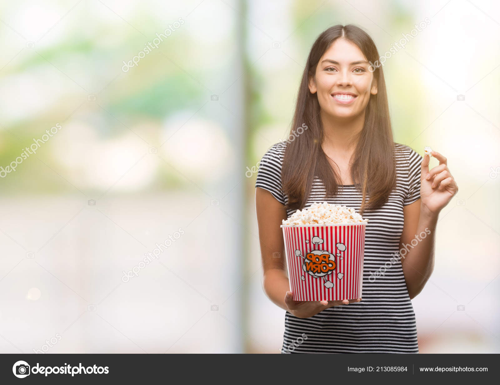 Young Beautiful Hispanic Eating Popcorn Happy Face Standing Smiling ...