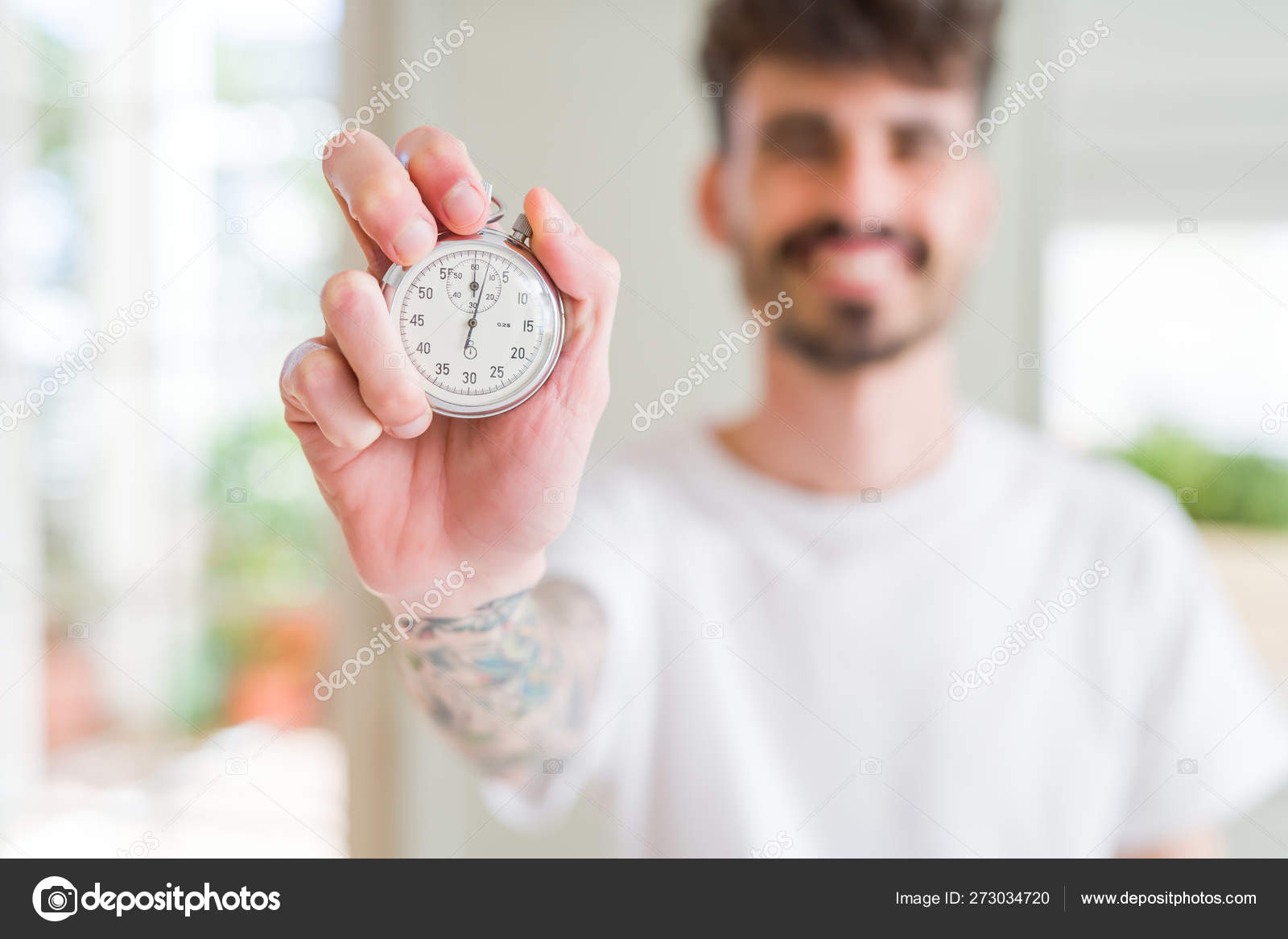 Young Man Using Holding Stopwatch Happy Face Standing Smiling Confident ...