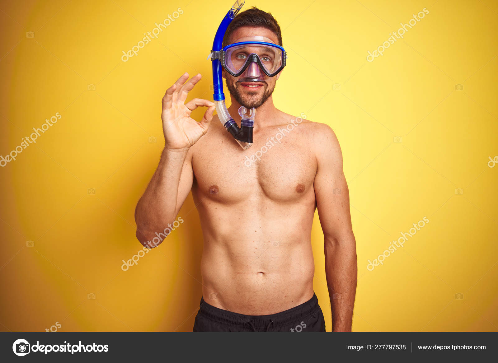 Young Handsome Shirtless Man Wearing Diving Goggles Isolated Yellow ... Young Handsome Shirtless Man Wearing Diving Goggles Isolated Yellow ...