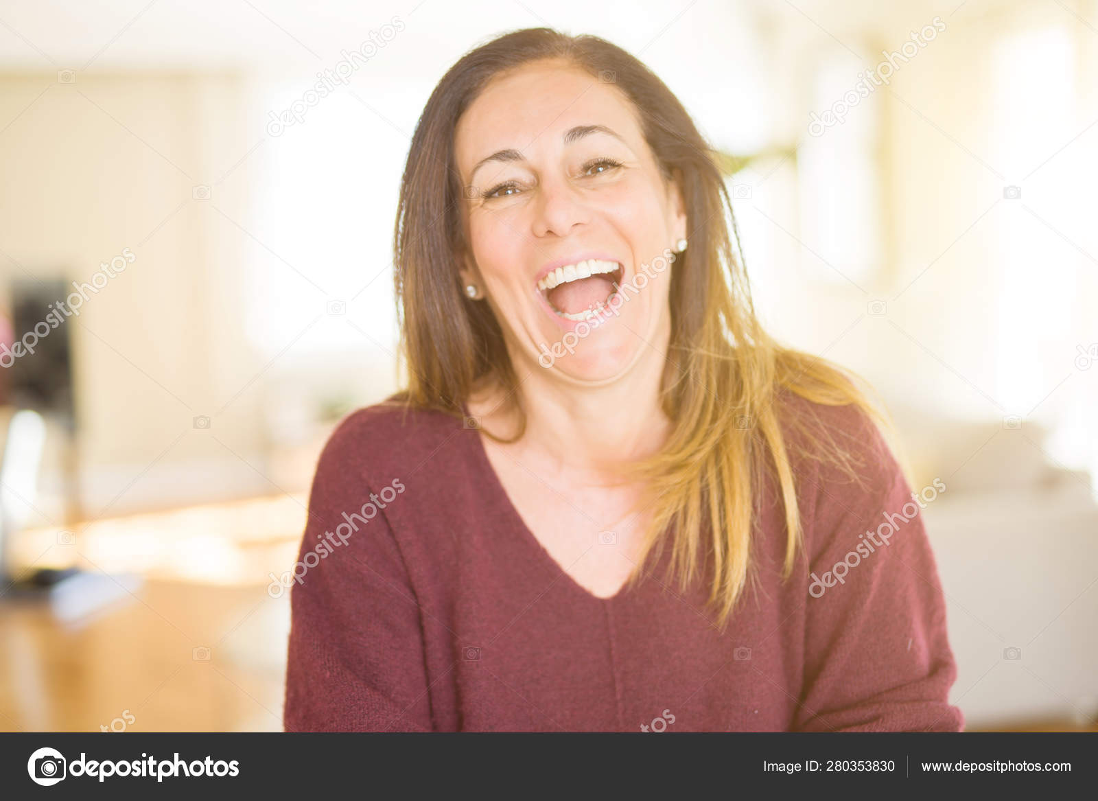 Beautiful middle age woman smiling at home — Stock Photo © Krakenimages.com #280353830
