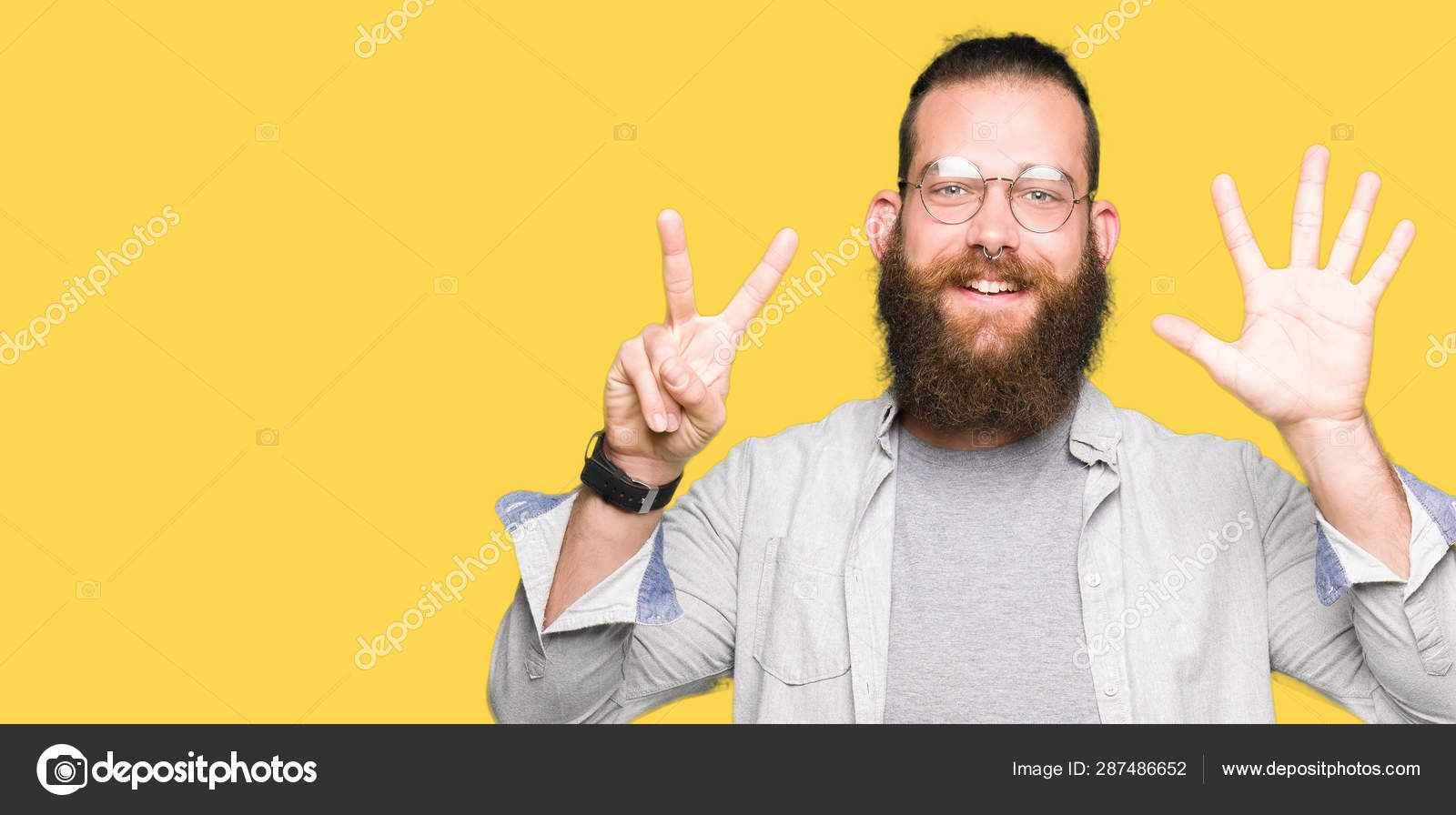 Young Blond Man Wearing Glasses Showing Pointing Fingers Number Seven ...