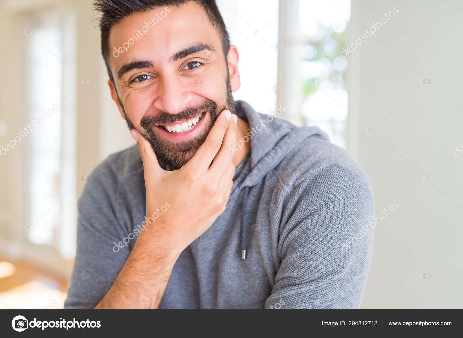 Handsome man smiling cheerful with a big smile on face showing t ...