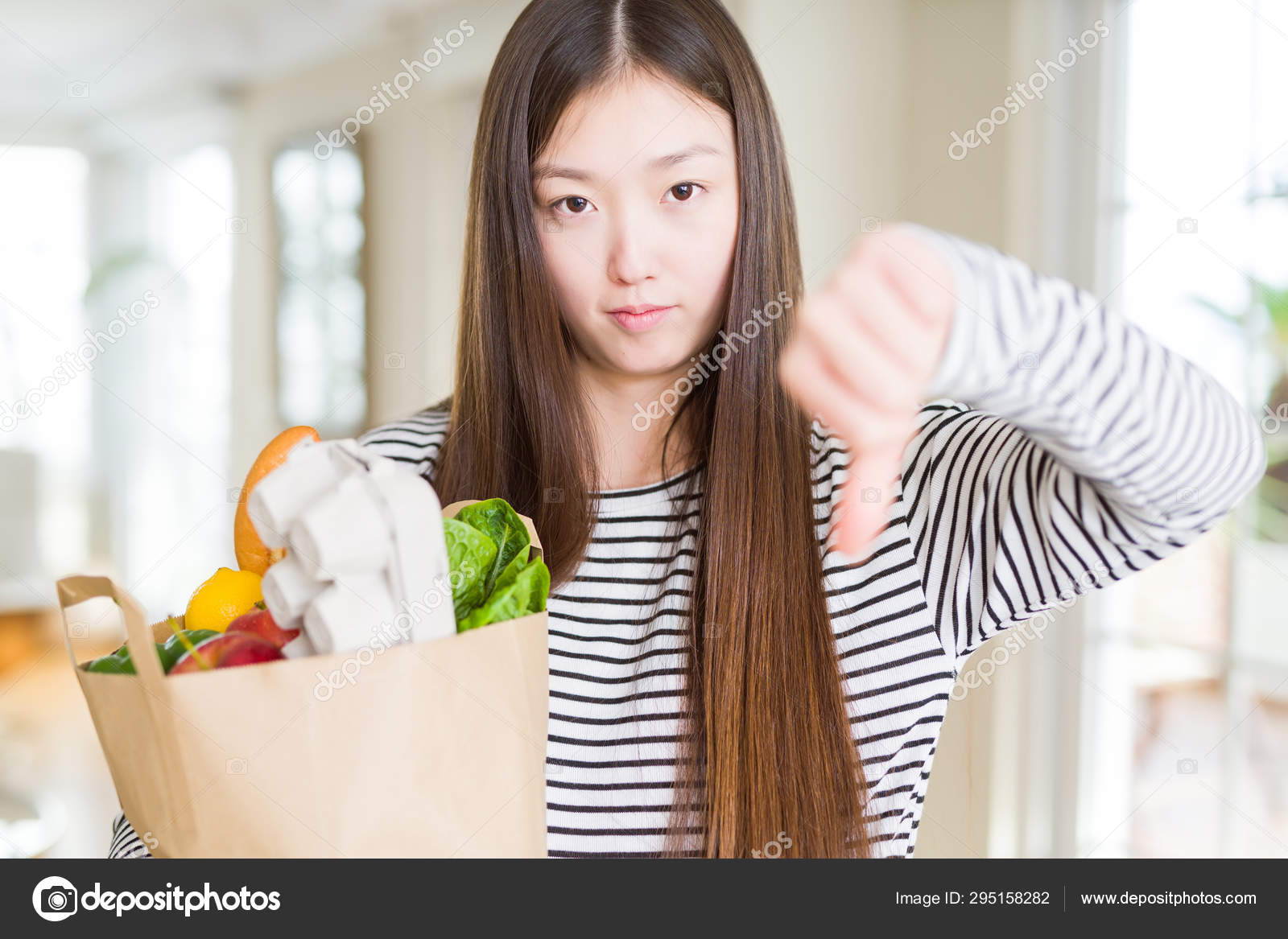 Beautiful Asian Woman Holding Paper Bag Fresh Groceries Angry Face