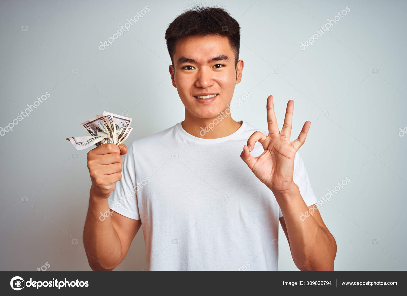 Young Asian Chinese Man Holding Dollars Standing Isolated White ...