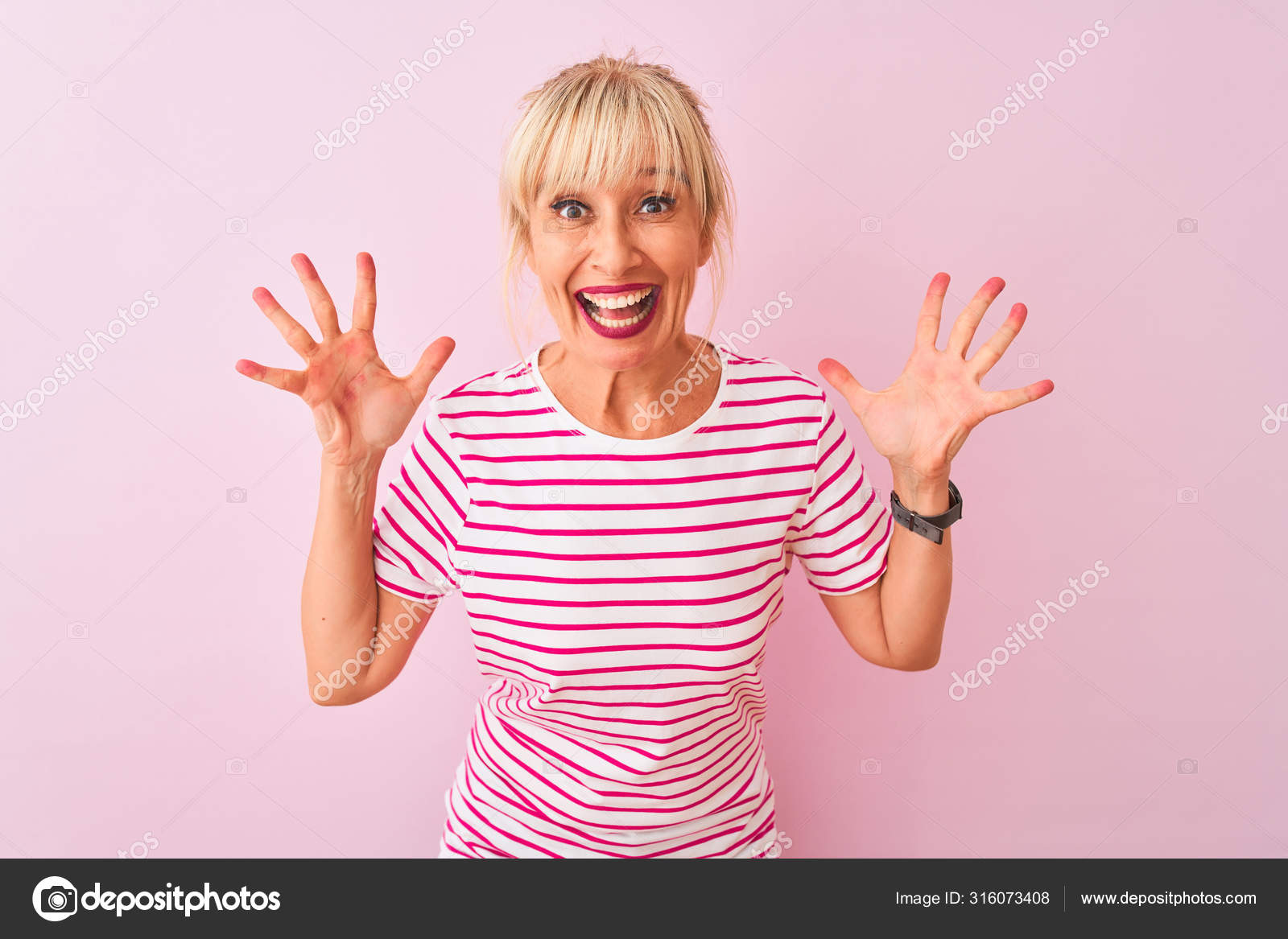 Middle Age Woman Wearing Striped Shirt Standing Isolated Pink