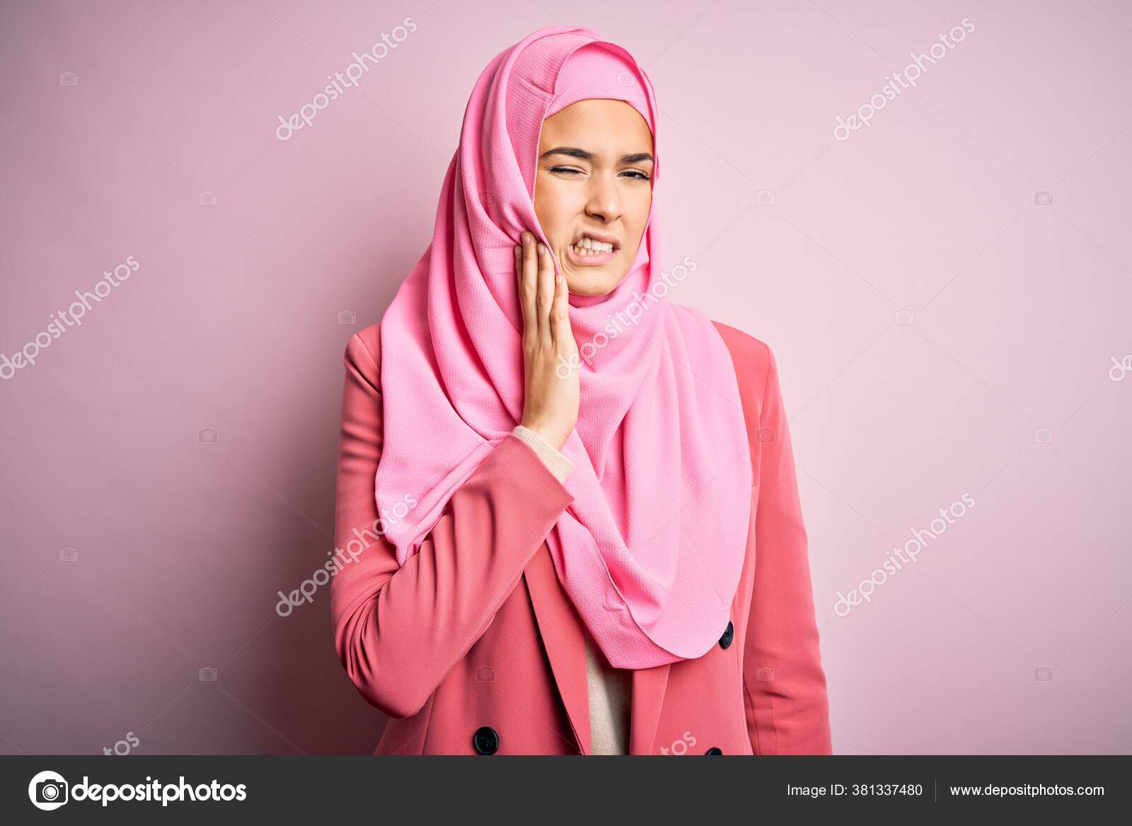 Young Beautiful Girl Wearing Muslim Hijab Standing Isolated Pink