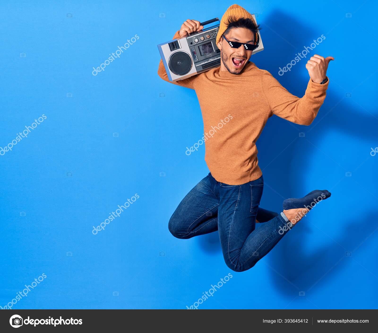 Young Handsome Latin Man Smiling Happy Wearing Thug Lif Sunglasses ... Young Handsome Latin Man Smiling Happy Wearing Thug Lif Sunglasses ...