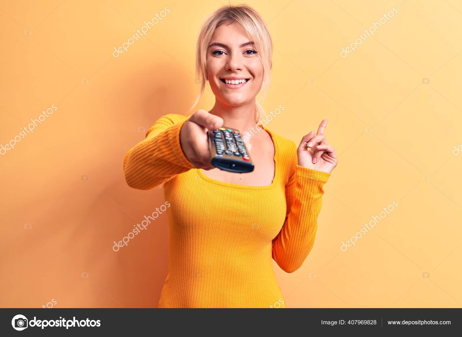 Blonde Woman Changing Channel Using Television Remote Control Yellow ... Blonde Woman Changing Channel Using Television Remote Control Yellow ...