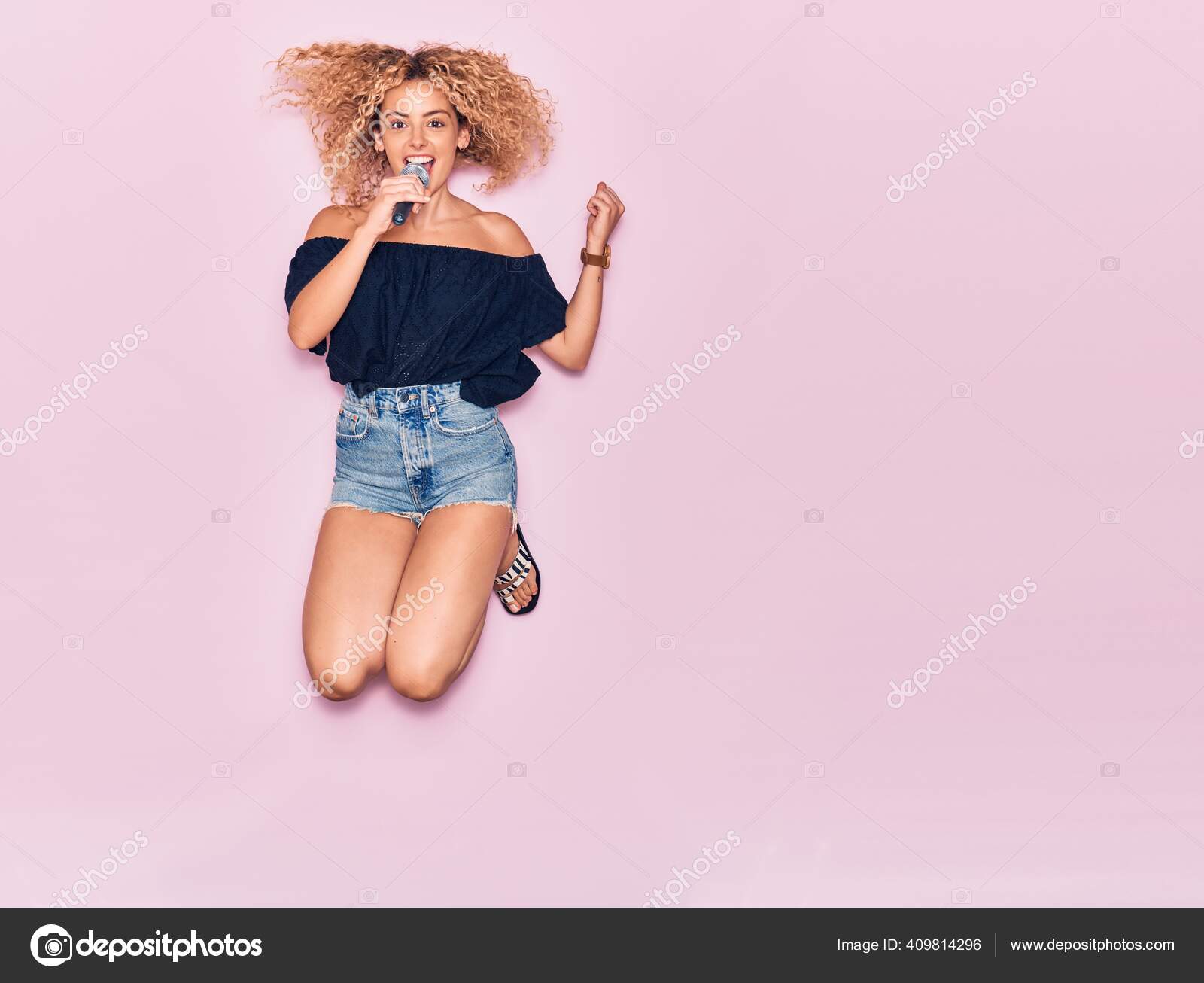Young Beautiful Curly Singer Girl Smiling Happy Singing Song Using