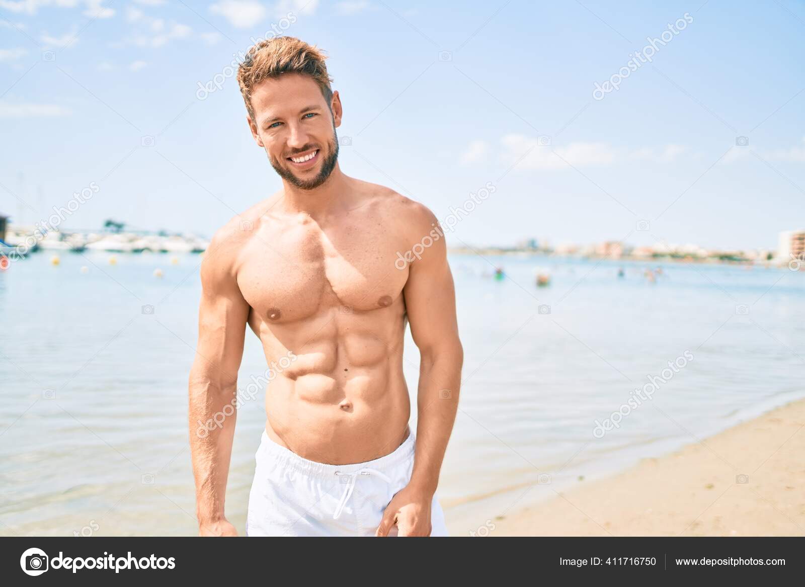 Handsome Fitness Caucasian Man Beach Sunny Day Showing Muscular Fitness