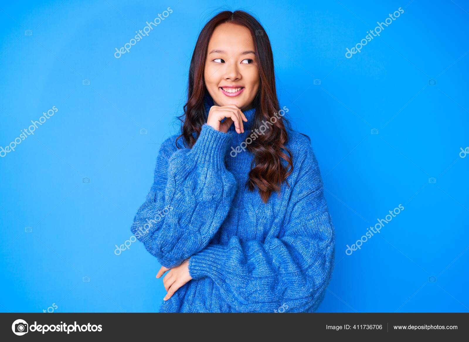 Young Beautiful Chinese Girl Wearing Casual Winter Sweater Hand Chin